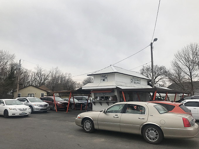 Cars gather like faithful worshippers at the altar of comfort food. Some traditions are worth preserving, one parking spot at a time.
