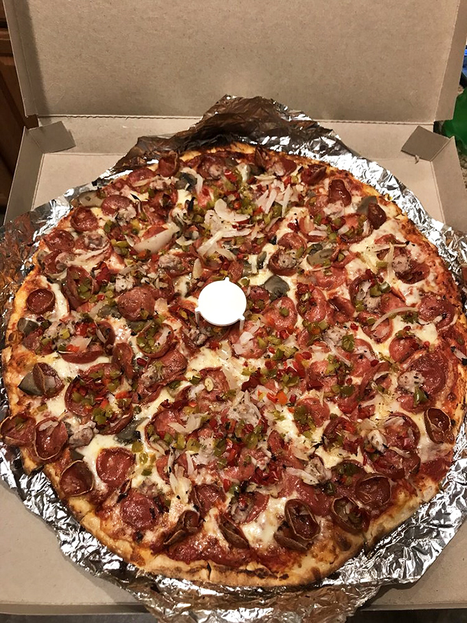 The deluxe pizza in its natural habitat&mdash;a cardboard box lined with foil, ready to transform an ordinary Ohio evening into something worth remembering. 