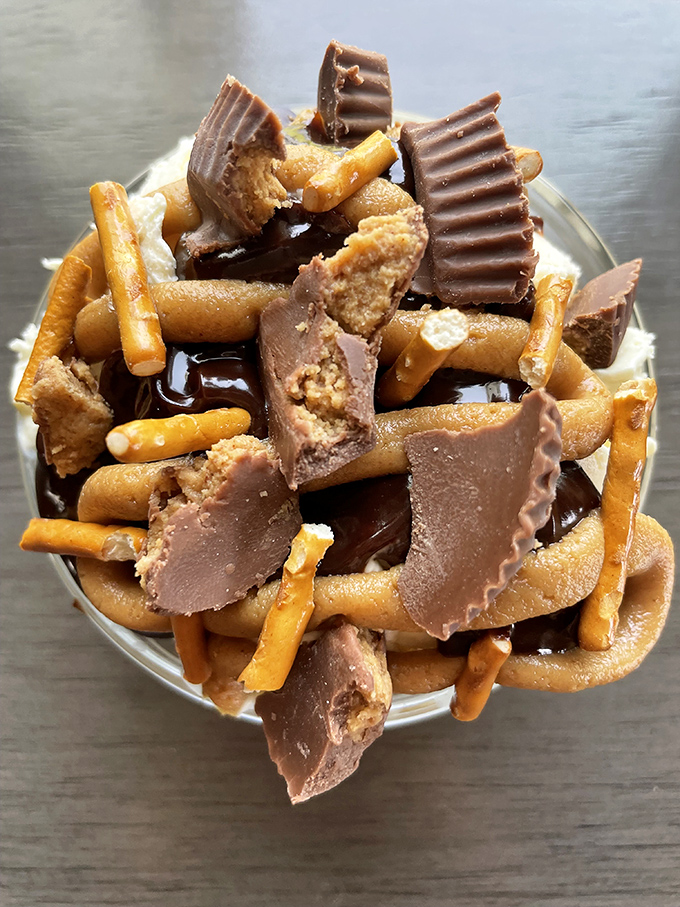 Pretzels and peanut butter cups collide in a dessert that would make Willy Wonka slow-clap with approval.