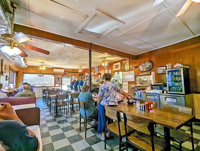 The morning congregation at Watkins Grill &ndash; where the checkered floor and ceiling fans set the stage for Raleigh's most democratic dining experience.
