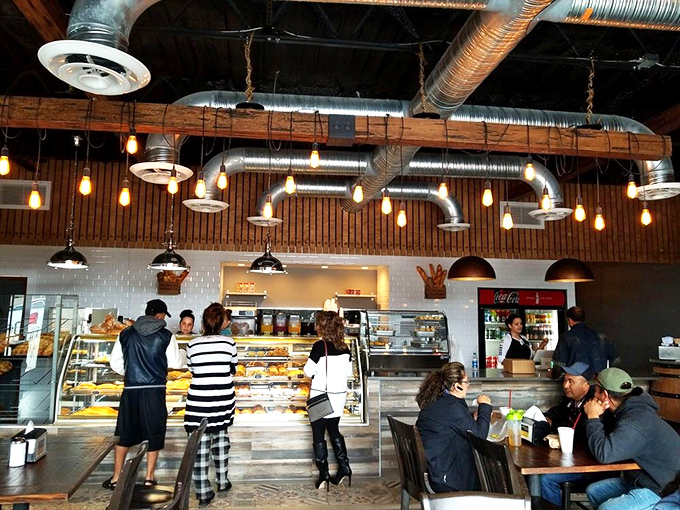 The bustling interior where strangers become comrades united by a common mission: to experience whatever delicious creation has everyone else standing in line.