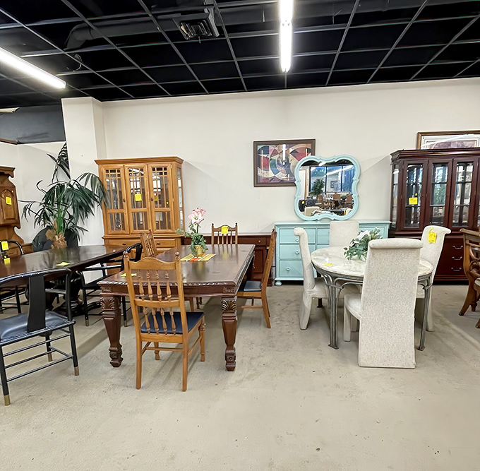 Dining sets arranged like a showroom for the indecisive&mdash;traditional oak sits beside contemporary glass, waiting for someone to take them home.