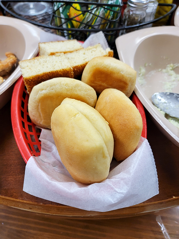 The bread basket featuring pillowy dinner rolls and cornbread&mdash;vehicles for sopping up every last drop of gravy, pot likker, and sauce on your plate.