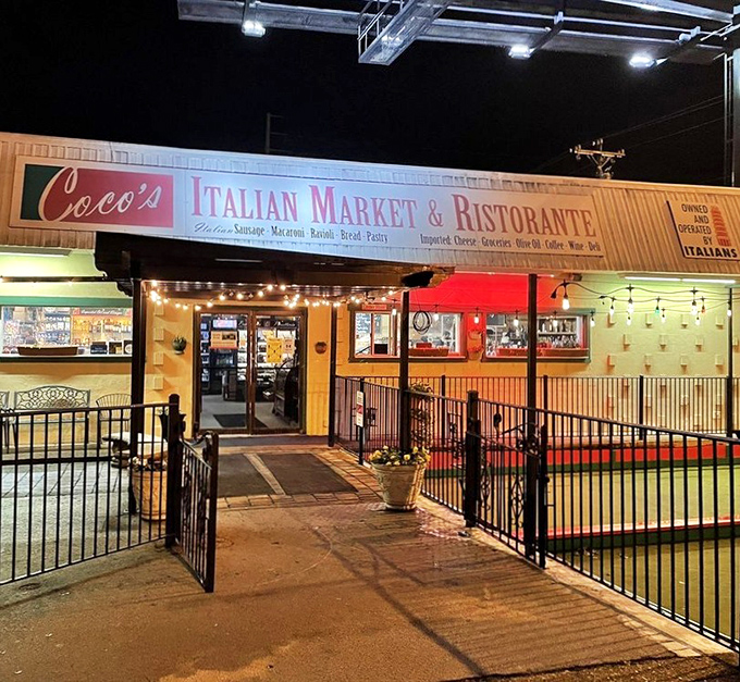By night, Coco's entrance glows with warm invitation, a beacon of carbohydrate comfort in a sea of Nashville hot chicken joints.