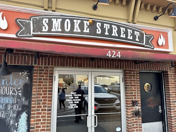 Winter hours posted on the door&mdash;because Michigan's barbecue cravings don't hibernate when the temperature drops.