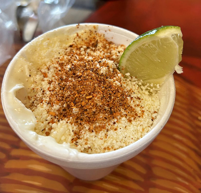 Esquites—street corn in a cup—topped with chile powder and lime, bringing the flavors of a Mexican mercado to your Indianapolis table.