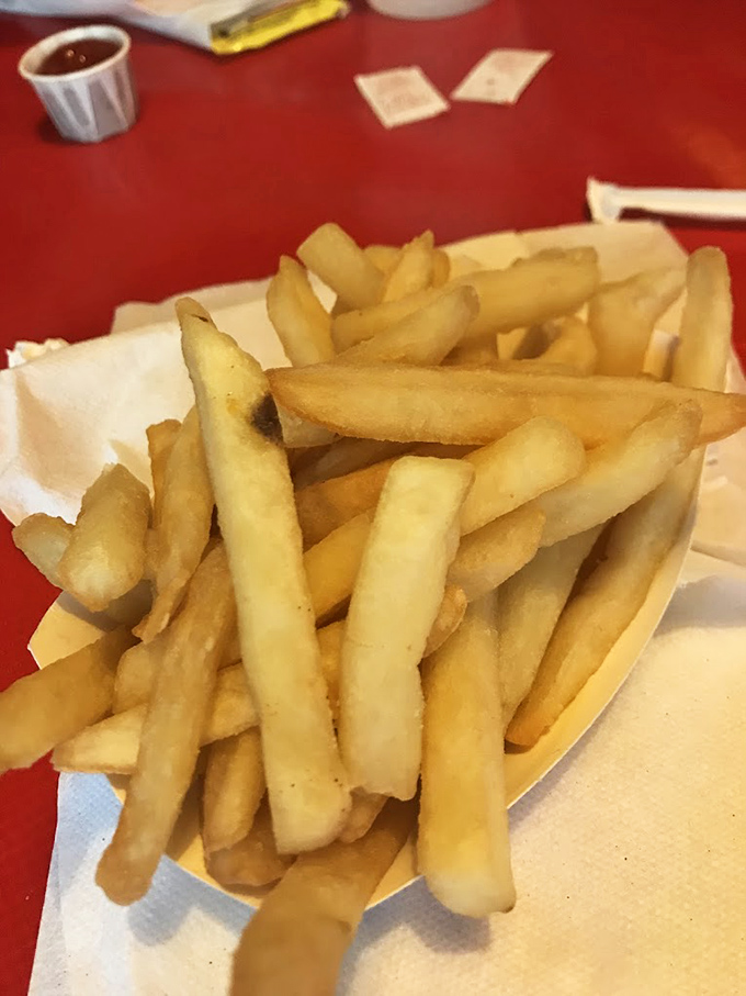 Golden, perfectly crisp fries served in a paper boat&mdash;the savory opening act before the sweet main event that is The Jigger Shop experience.