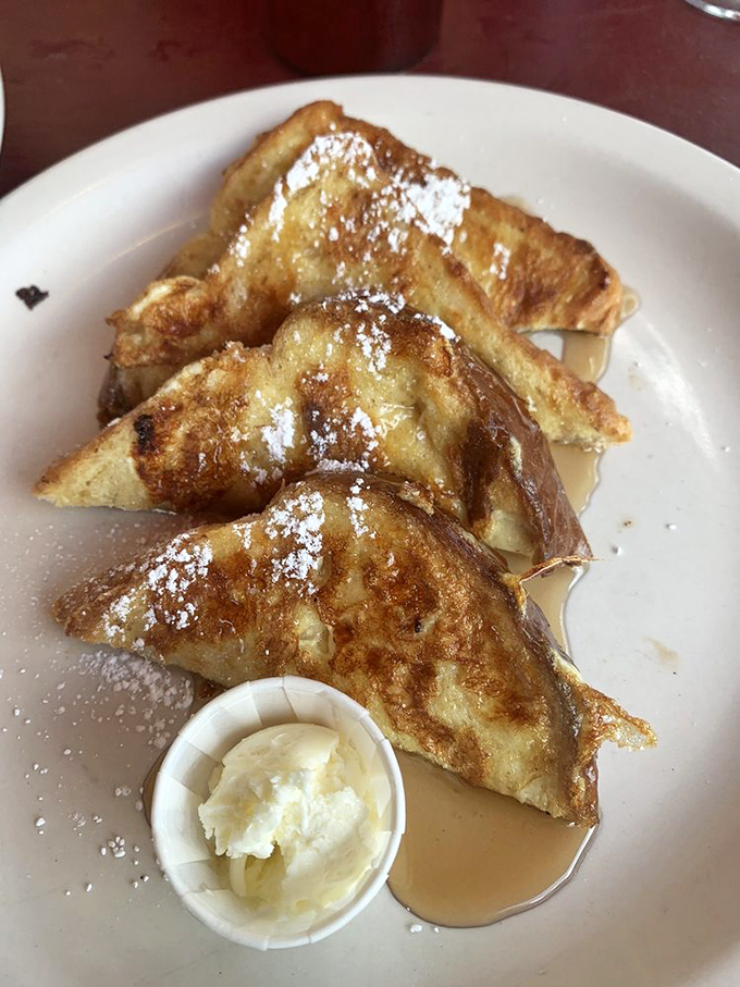 French toast that makes bread feel special again. That dusting of powdered sugar isn't decoration&mdash;it's the final blessing on a breakfast masterpiece.
