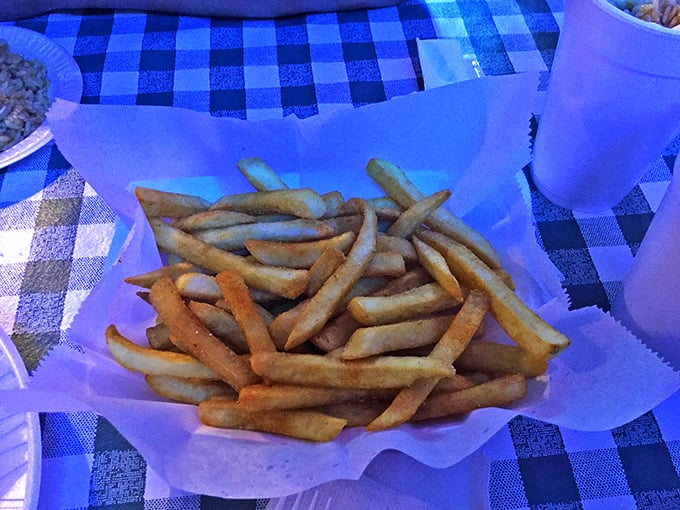 French fries in their natural habitat: nestled in paper, ready to be the perfect vehicle for whatever sauce remains on your fingers.