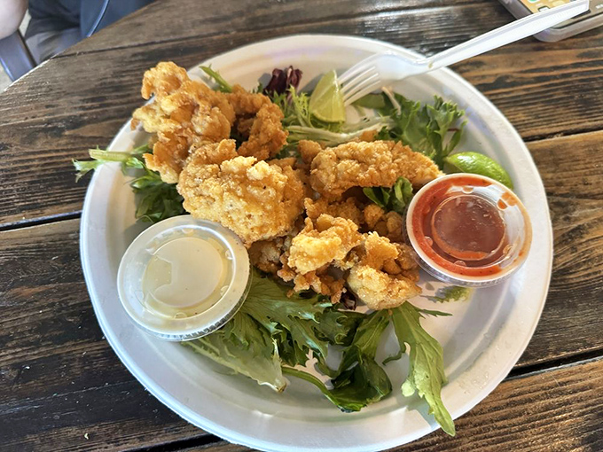 Nature's candy from the sea. These tender morsels of cracked conch rest on a bed of greens, ready to transport you to island paradise.