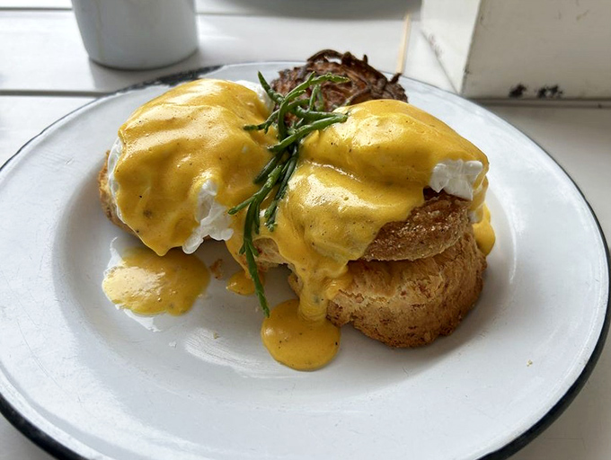Poached eggs draped in hollandaise like sunshine-colored silk, proving that breakfast can indeed be both art and comfort.