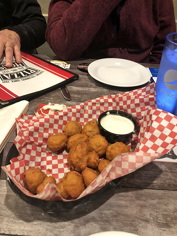 These golden-fried mushrooms aren't just appetizers—they're bite-sized pleasure bombs with a side of ranch for that perfect Midwest finish.