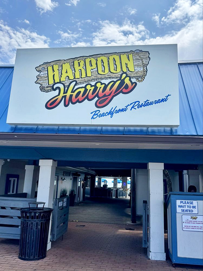 The entrance promises Florida seafood dreams with its bold sign and blue roof&mdash;like a portal to vacation mode.