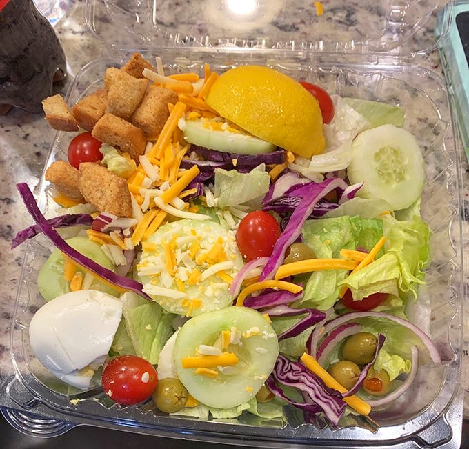 Even the salad looks happy to be here&mdash;fresh, colorful, and proving that occasionally eating something green makes all that fried chicken justified.