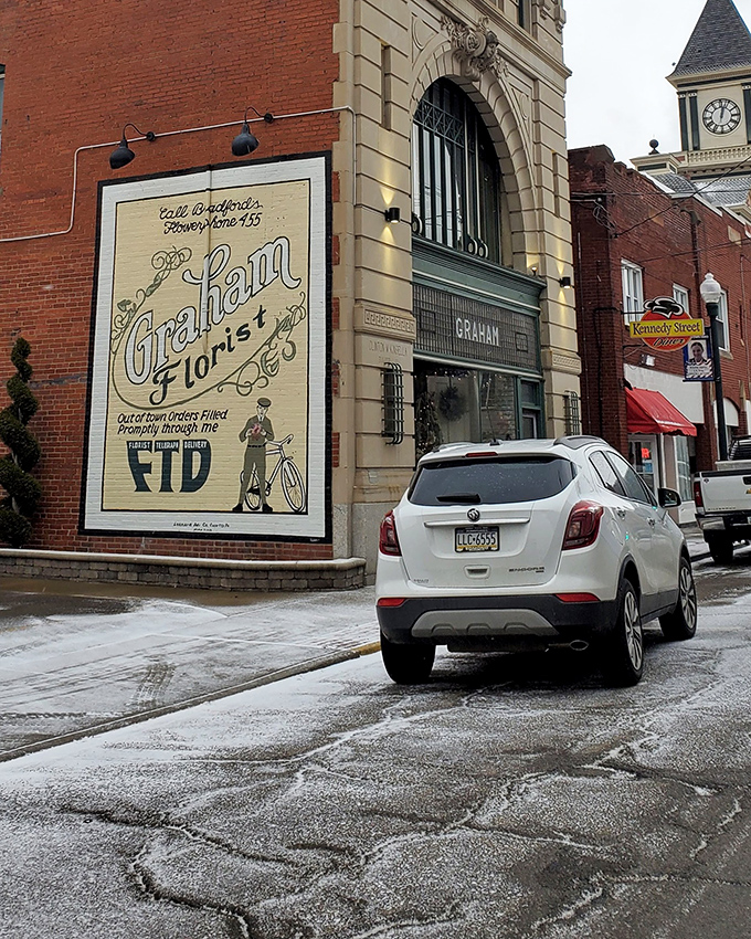 Vintage advertising adorns historic buildings, where Graham Florist's painted sign reminds us of an era before digital billboards and pop-up ads.