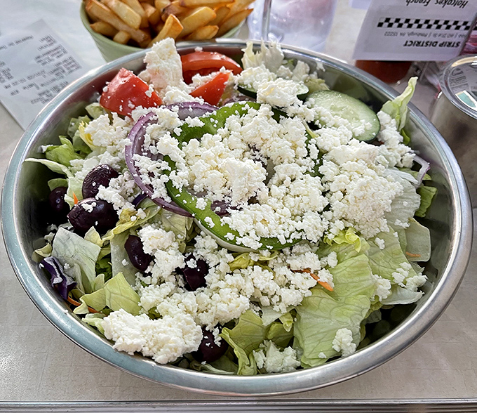 The Greek salad that offers a moment of virtuous eating before you inevitably order another round of those famous hotcakes for dessert.