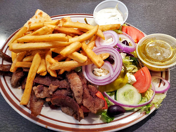 This isn't just a gyro platter&mdash;it's a Mediterranean vacation for your mouth with crispy fries playing in the sand beside cool cucumber and tomato waves.