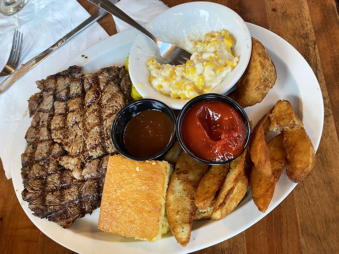 This hickory-smoked ribeye with its perfect grill marks sits beside corn casserole so good you'll want to call your mother and apologize.
