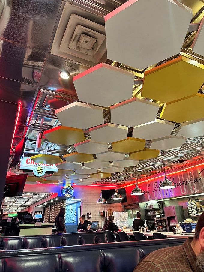 Those honeycomb ceiling panels aren't just decorative &ndash; they're a reminder that you're in a hive of breakfast activity where sweet experiences are guaranteed.