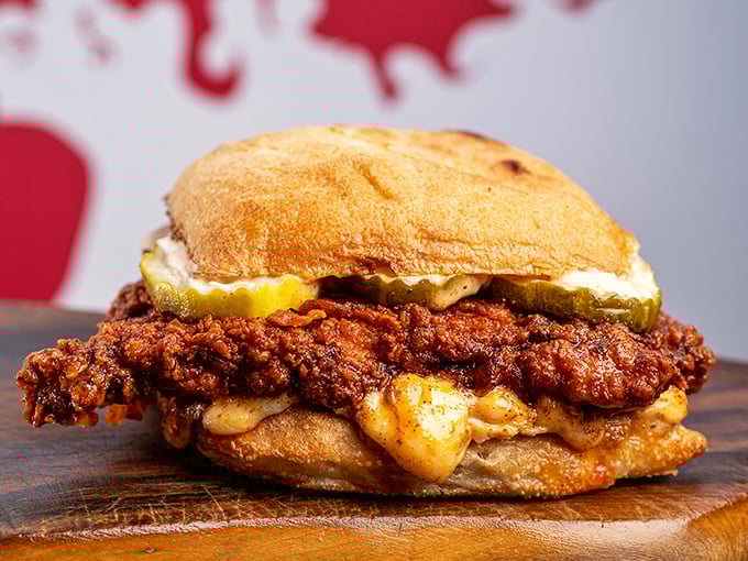 The hot chicken sandwich that's worth the inevitable shirt stain. That pickle and bun are working overtime to contain the situation.