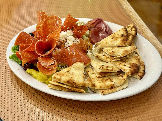 The hummus platter arrives like a Mediterranean vacation for your taste buds, no passport required&mdash;just a healthy appetite and willing companions.