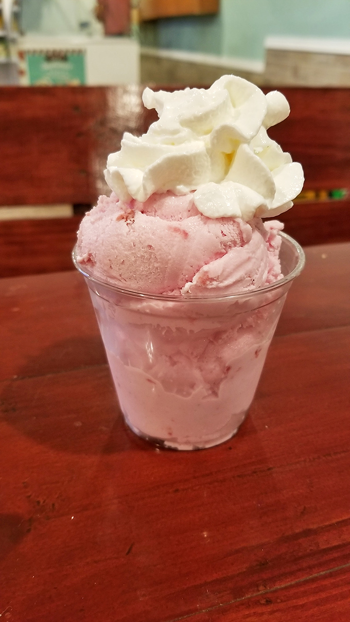 Strawberry ice cream topped with whipped cream&mdash;summer in a cup, no sunscreen required.