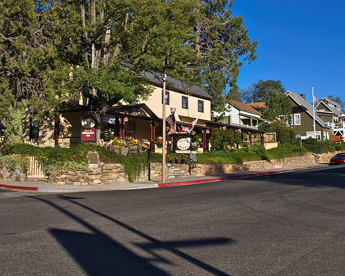 The Julian Gold Rush Hotel stands as a cheerful yellow beacon of hospitality, its Victorian charm preserved for modern visitors seeking a taste of history.