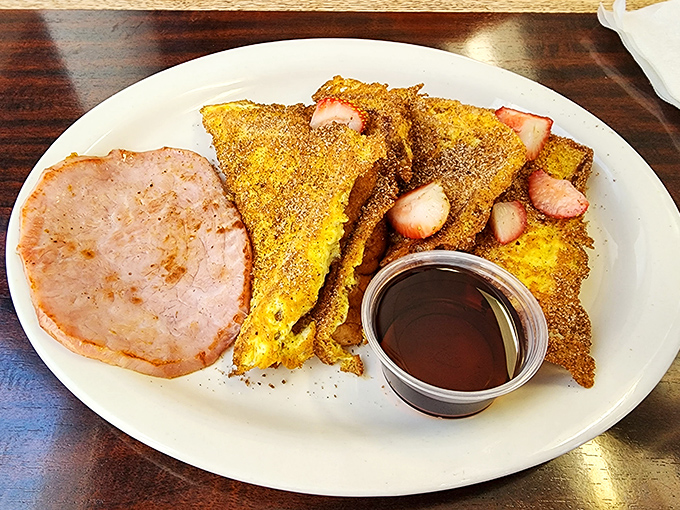 French toast that's achieved the golden ratio of crispy exterior and custardy center, with ham that's stepped up to the breakfast plate. This isn't just a meal, it's morning poetry.