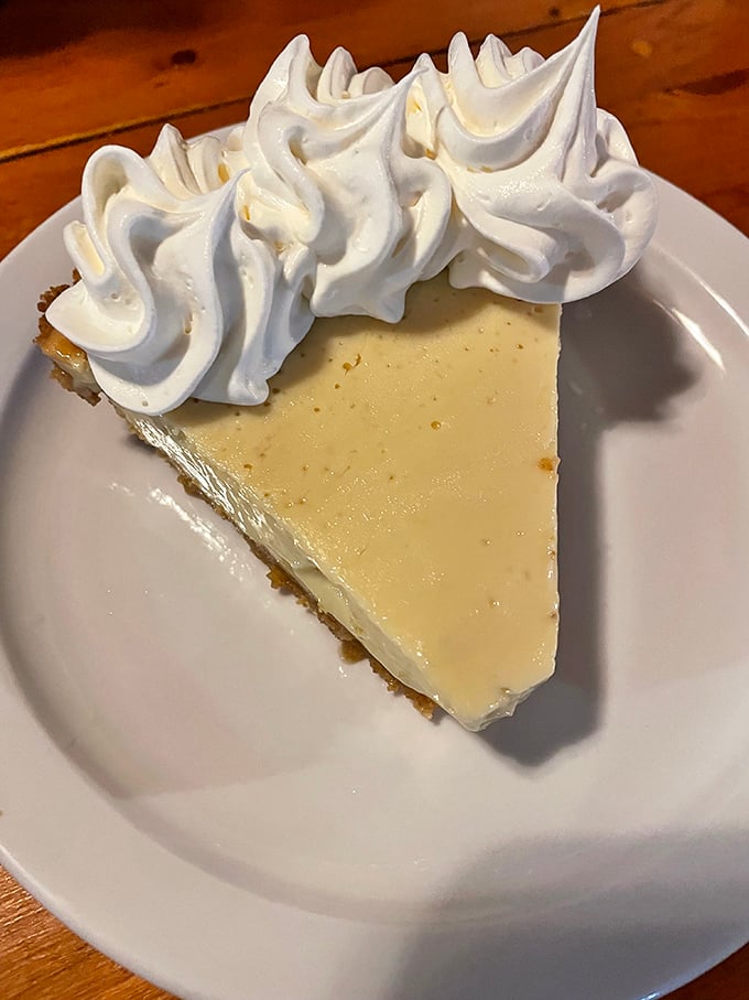 Key lime pie with a cloud of whipped cream that's the dessert equivalent of a perfect day at the beach—bright, refreshing, and gone too soon.