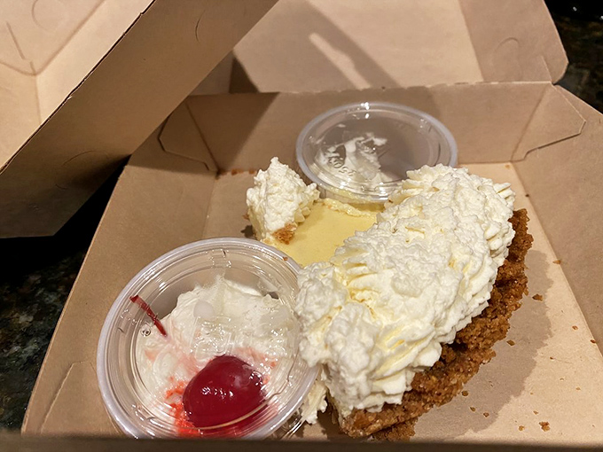 Key lime pie in New England that somehow tastes like Florida sunshine. The whipped cream-to-pie ratio shows someone in the kitchen truly cares.