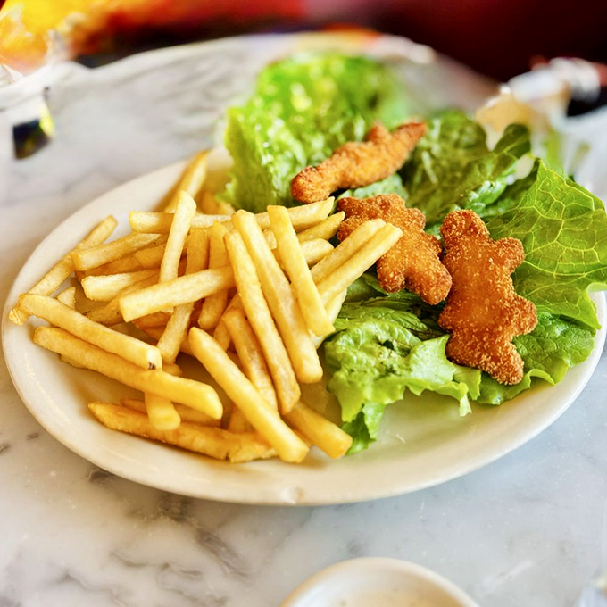Even the kids' menu gets the royal treatment—golden fries and whimsical chicken tenders that make grown-ups steal from their children's plates.