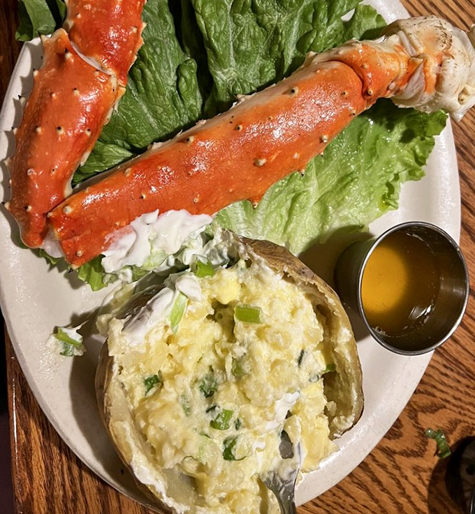 King crab legs that make you feel like royalty, served with a baked potato that's been loaded up like it's preparing for hibernation.