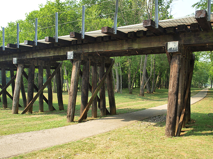 Lanana Creek Trail's rustic wooden bridge invites exploration. Nature and history intertwine along this peaceful path through the pines.