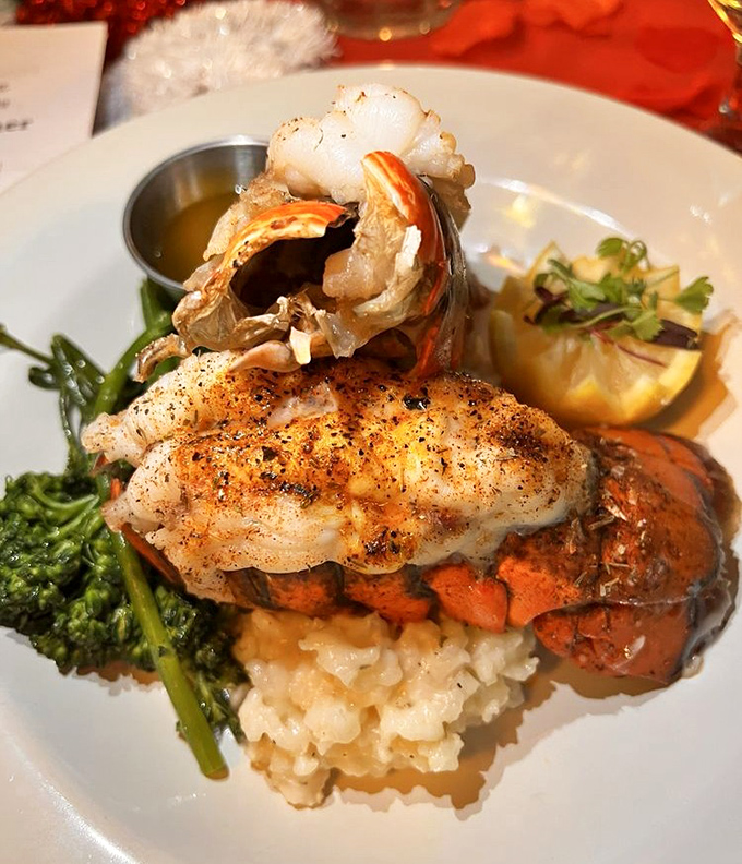 This isn't just seafood—it's the ocean's finest offering, perched atop risotto like Neptune's crown jewels on a cloud of buttery perfection.
