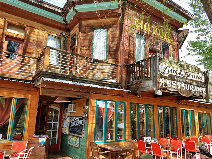 Duck Brand Restaurant's wooden charm and outdoor seating invite you to linger over meals, where time slows down and conversations flow as easily as the nearby river.