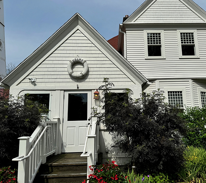 The keeper's house entrance welcomes visitors with classic nautical charm that would make any sailor feel at home.