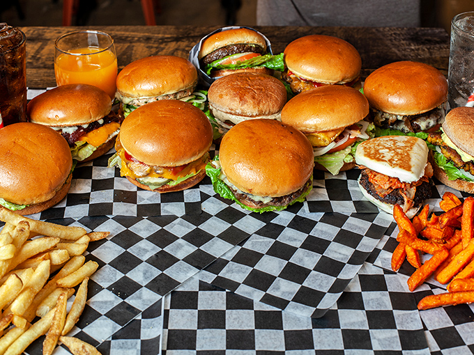 The burger family reunion you want to crash. This spread isn't just a meal&mdash;it's a celebration where everyone's invited and nobody leaves hungry.