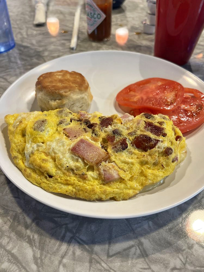 An omelet that doesn't just contain meat &ndash; it celebrates it, alongside a biscuit so perfect it deserves its own Instagram account.