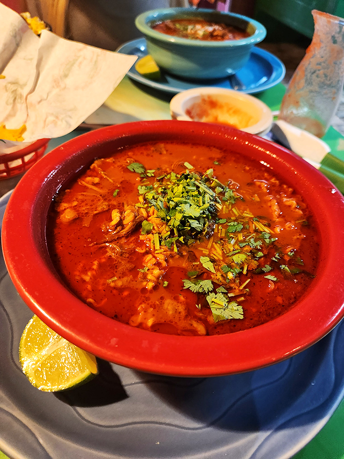 This menudo isn't just soup&mdash;it's a spicy, soul-warming tradition in a bowl, garnished with fresh cilantro and a lime wedge that's not just for show.