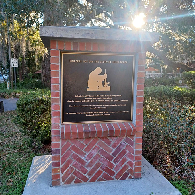 Micanopy's veterans memorial catches the golden Florida sunlight, honoring those who served with the quiet dignity that defines this remarkable small town.