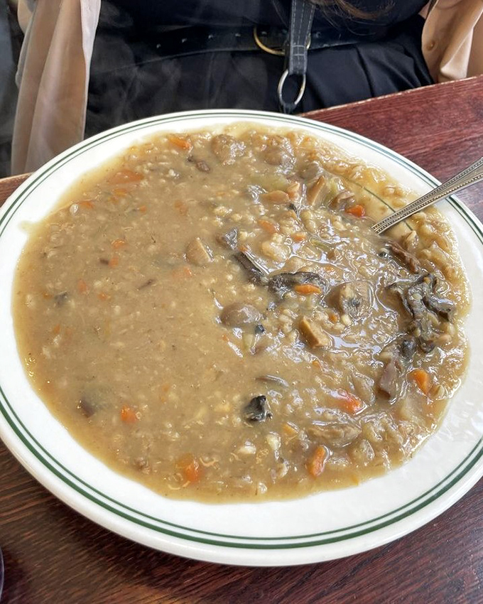 Mushroom barley soup thick enough to stand a spoon in – the kind that makes you feel loved, nourished, and slightly better at adulting.