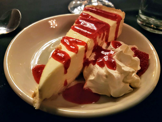 Cheesecake with a raspberry sauce signature that looks like modern art. Dense, creamy, and worth every minute on the treadmill tomorrow.