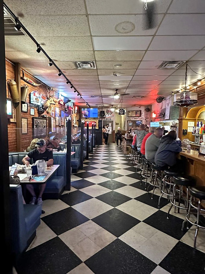 The classic black and white floor leads patrons to chicken paradise, while bar seating offers front-row views of the action.