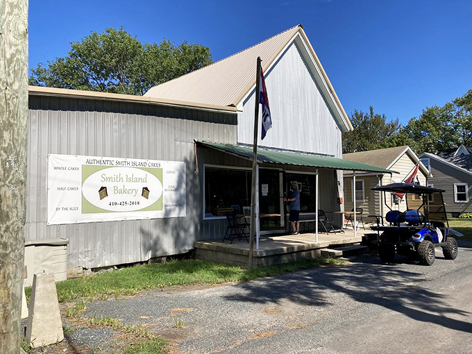 The bakery's metal siding gleams in Maryland sunshine, while a parked golf cart hints at the island's unhurried pace &ndash; just slow enough to savor every bite.