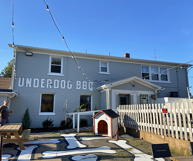 The outdoor patio features a dog house and bone-shaped pathway&mdash;because even in your leisure time, Underdog keeps its playful theme going strong.