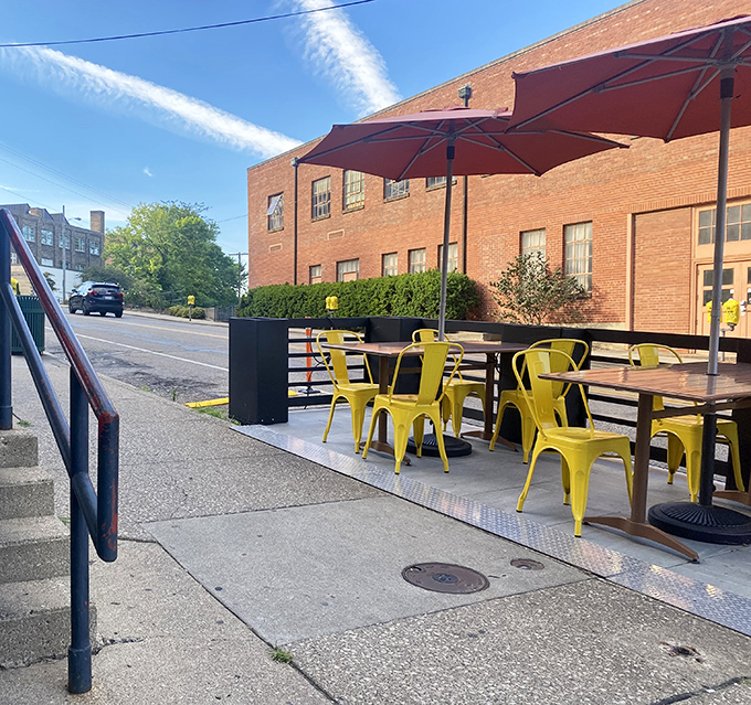 Sunny yellow chairs brighten up the outdoor patio space. Perfect for people-watching while demolishing a stack of pancakes.