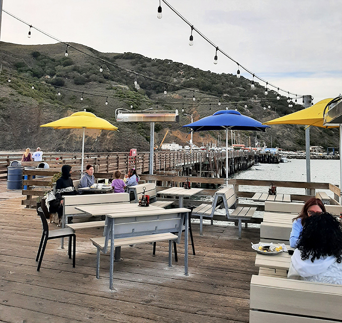 Dining al fresco under string lights with hills rising in the background&mdash;this isn't just lunch, it's the California dream served with a side of ocean breeze.