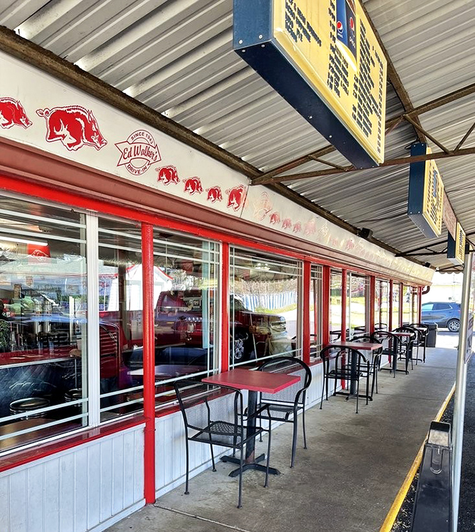 Arkansas Razorback pride meets roadside dining perfection. These outdoor tables have hosted countless conversations over French dips and cold drinks.