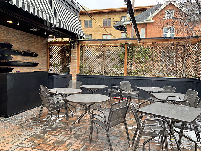 The brick-paved patio offers a perfect urban oasis for enjoying your cheesecake while contemplating life's important questions&mdash;like "Should I order seconds?"
