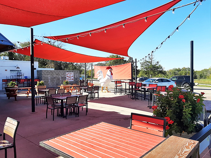 Outdoor dining that doesn't feel like an afterthought. Red shade sails and thoughtful landscaping create an oasis for enjoying those famous chicken dishes al fresco.